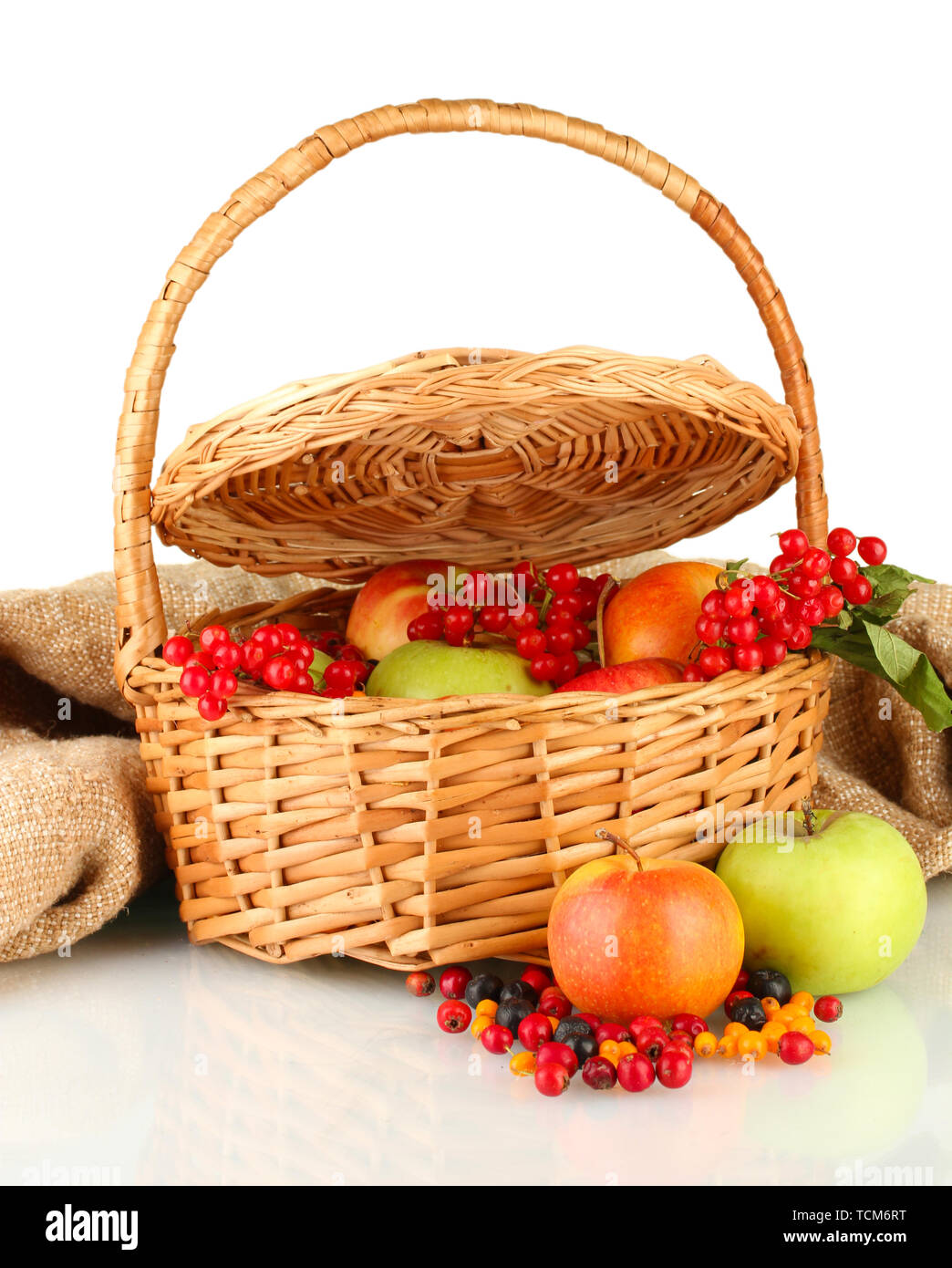 crop of berries and fruits in a basket on white background close-up ...