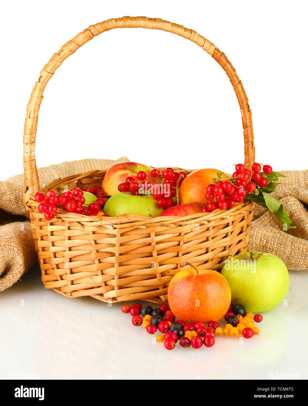 crop of berries and fruits in a basket on white background close-up ...