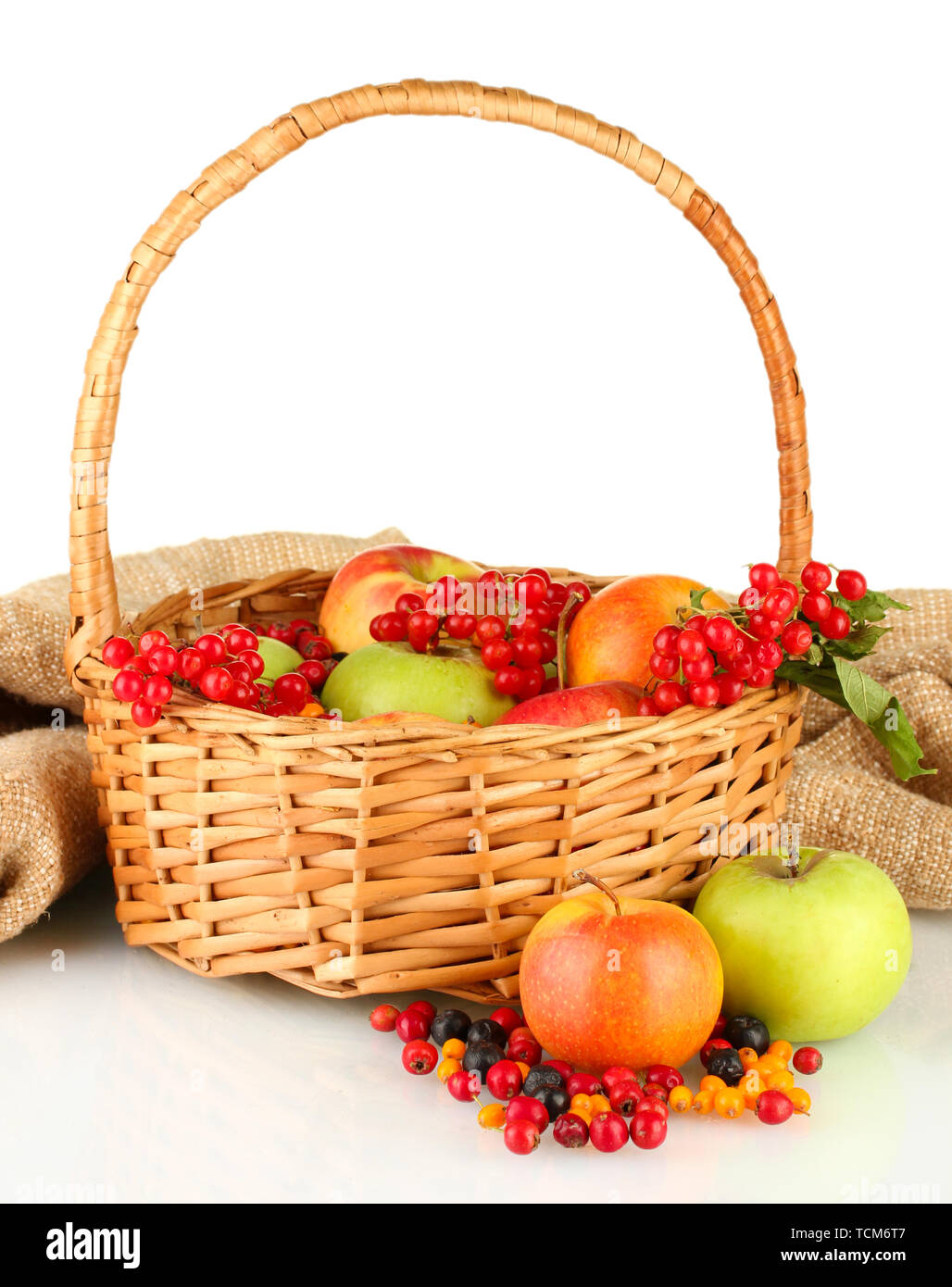 crop of berries and fruits in a basket on white background close-up ...