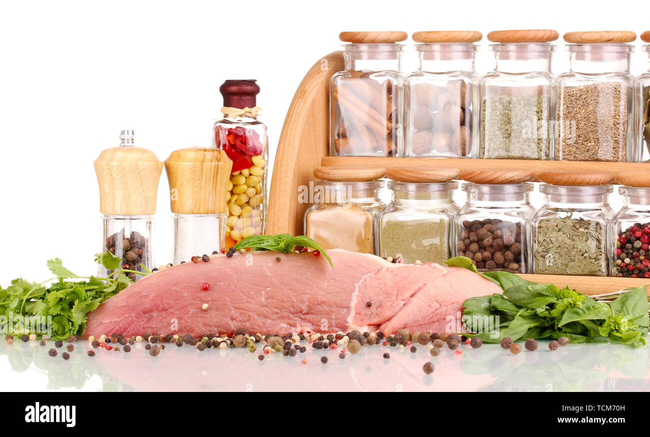 A large piece of pork marinated with herbs and spices isolated on white ...