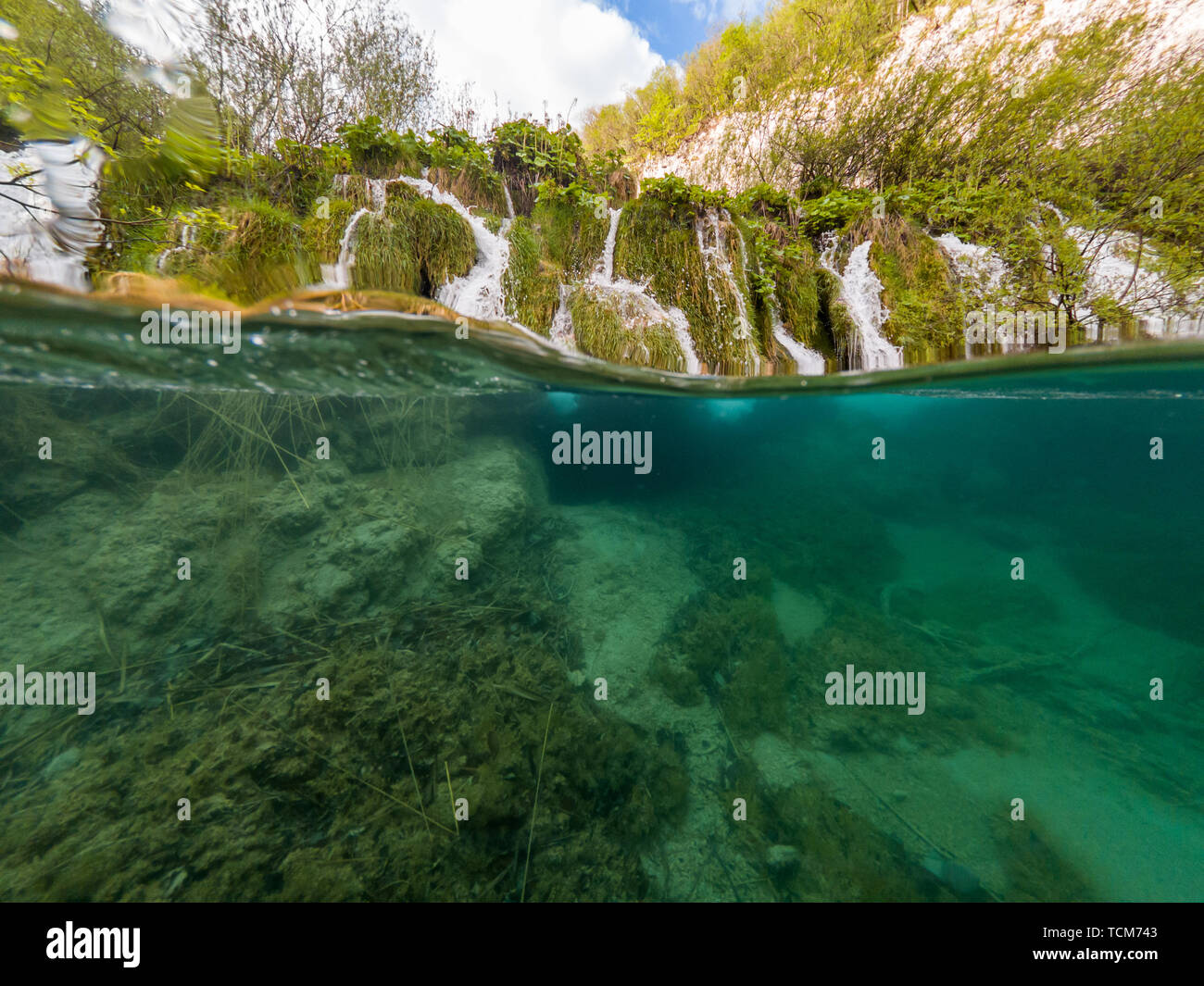 Amazing split view of waterfalls falling into lake. Plitvice national ...