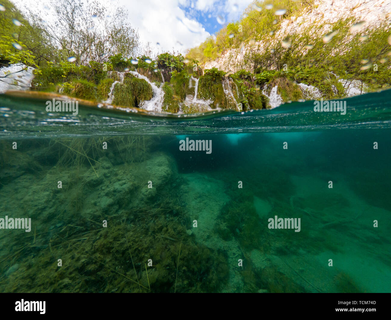 Amazing split view of waterfalls falling into lake. Plitvice national ...