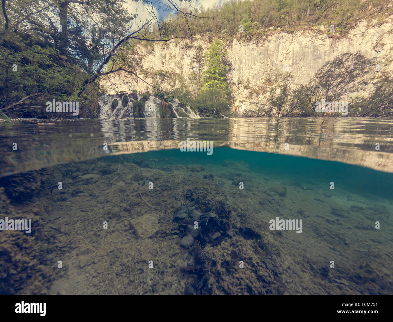 Amazing split view of waterfalls falling into lake. Plitvice national ...