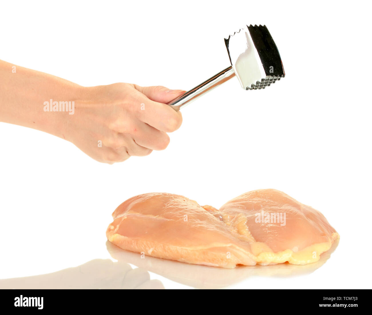 woman's hand beats chicken on white background close-up Stock Photo - Alamy