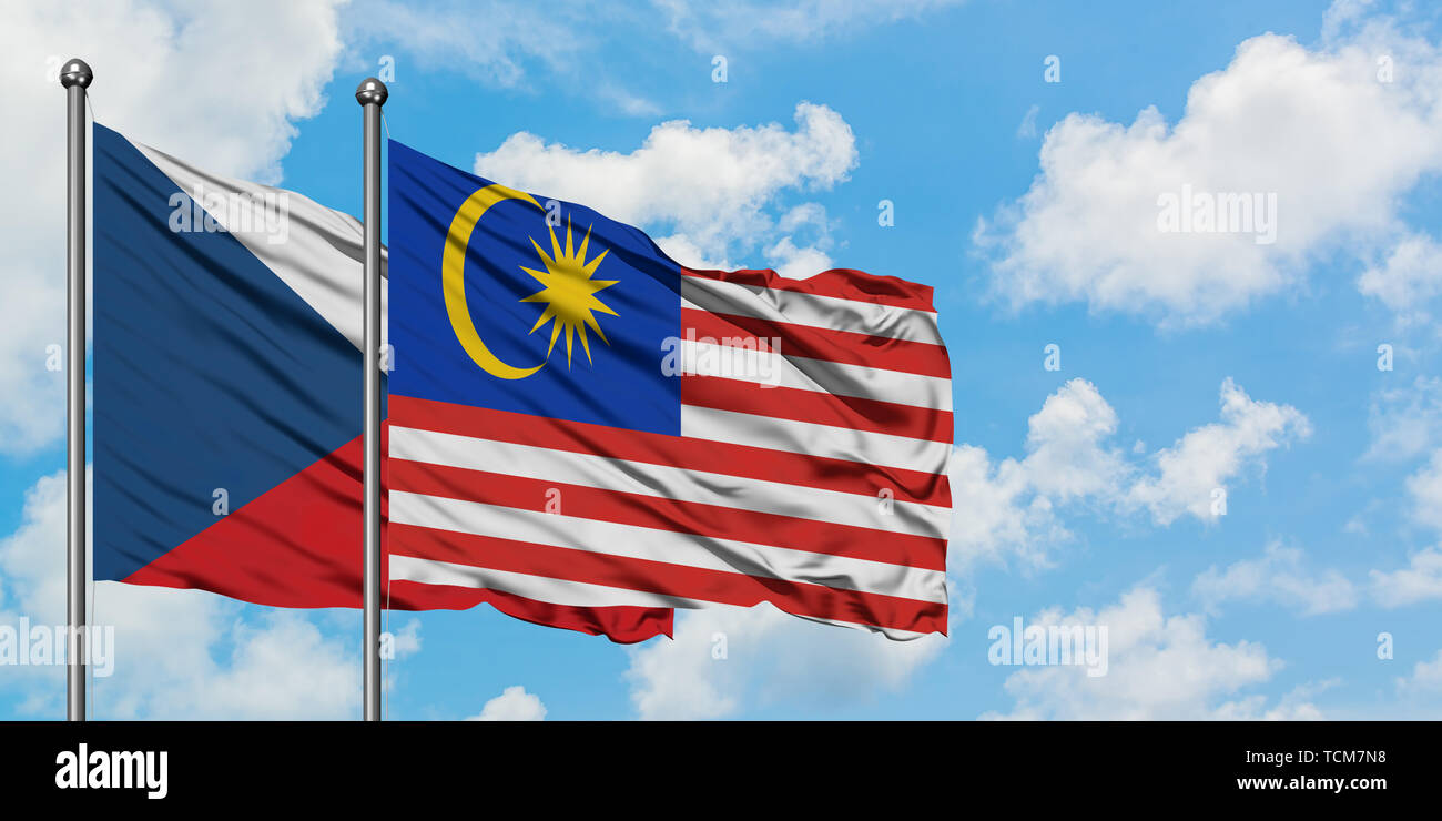 Czech Republic and Malaysia flag waving in the wind against white ...