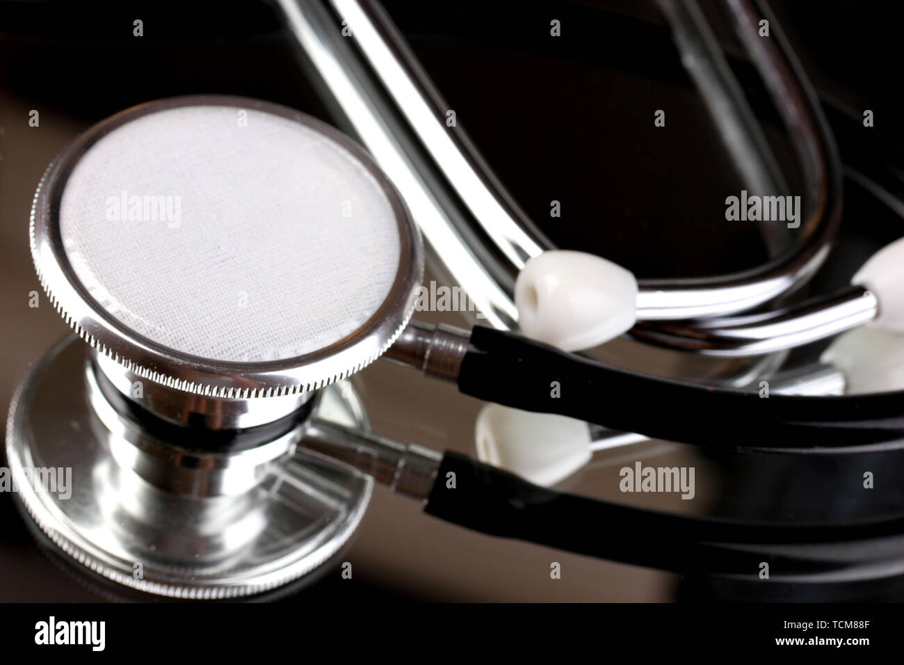 Stethoscope close-up isolated on black Stock Photo - Alamy