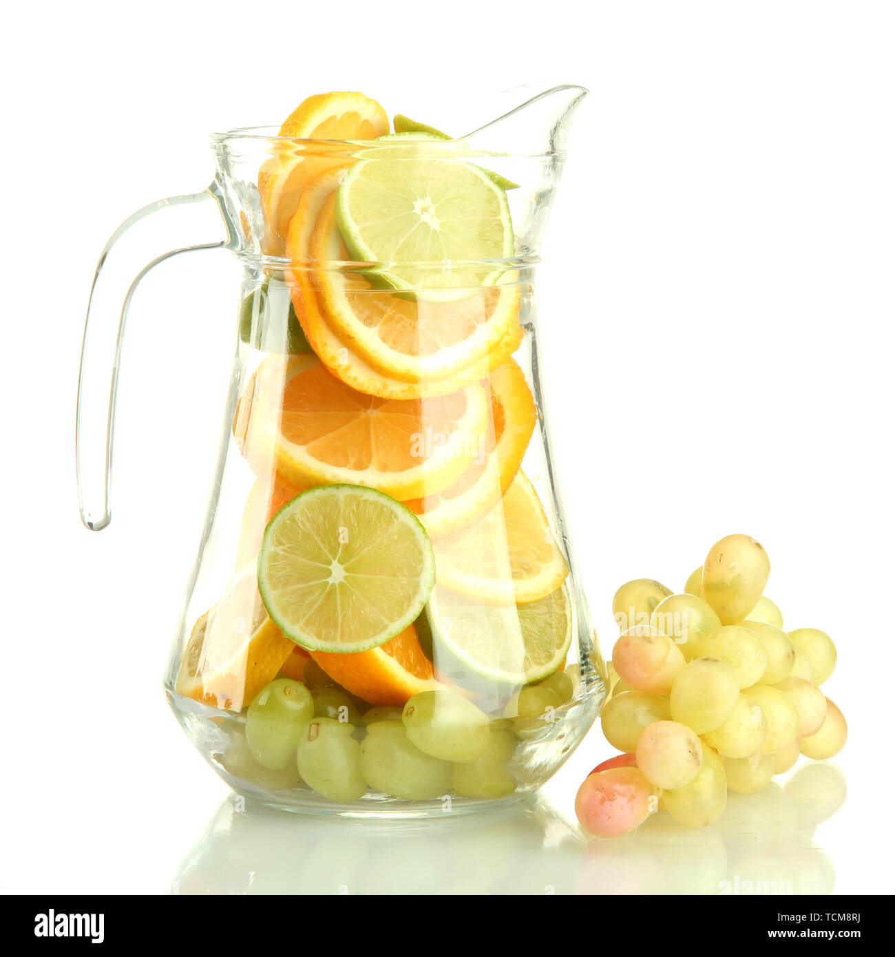 transparent jar with citrus fruits and grape, isolated on white Stock ...
