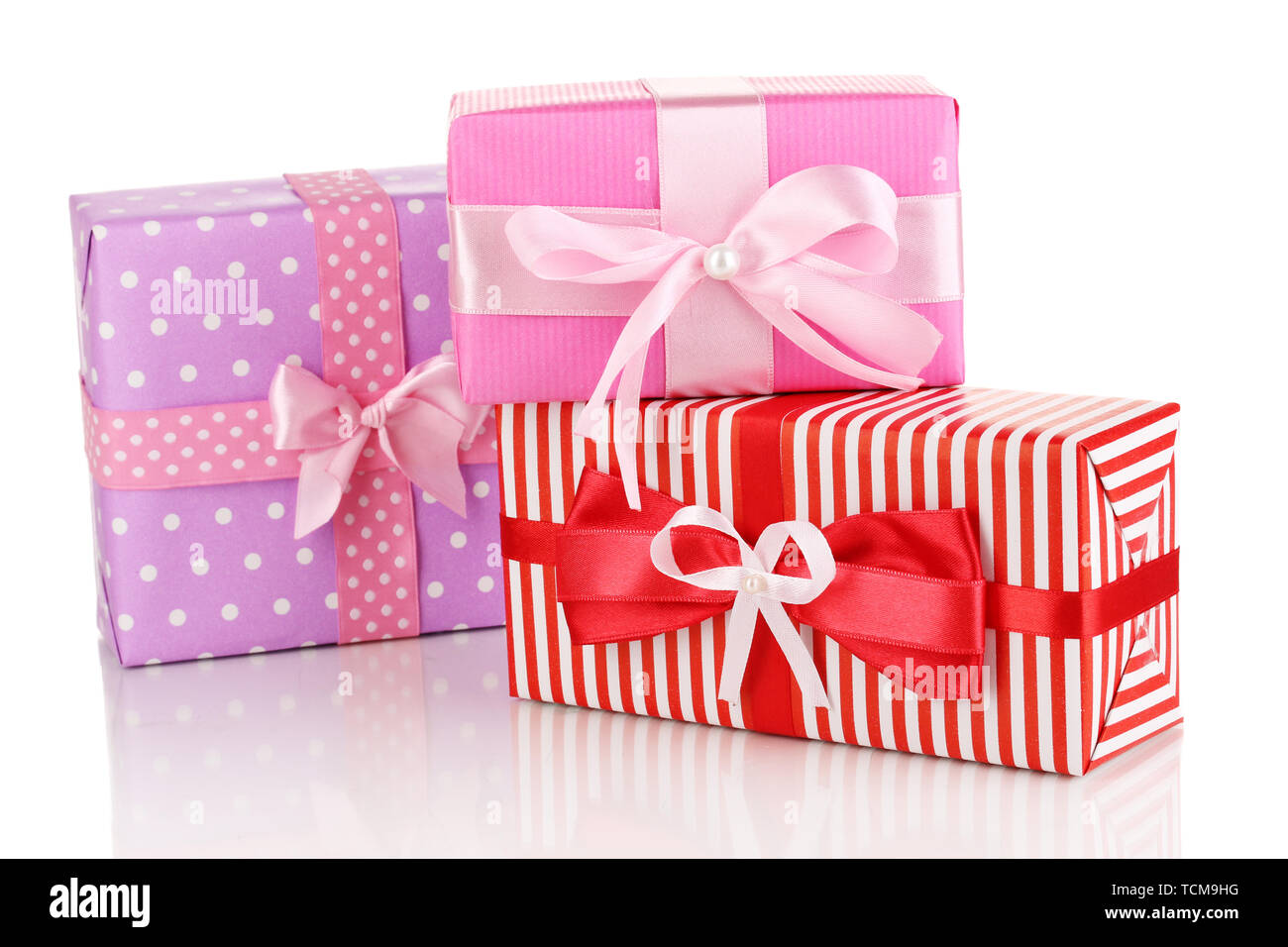 Colorful red, pink and purple gifts isolated on white Stock Photo - Alamy