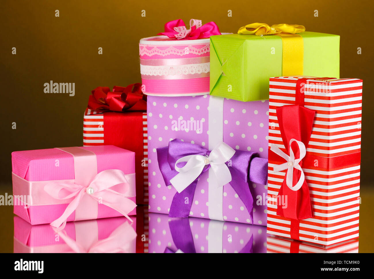 Colorful gifts on orange background Stock Photo - Alamy
