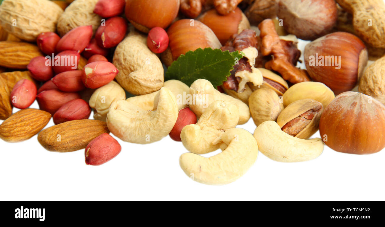 assortment of tasty nuts with leaves, isolated on white Stock Photo - Alamy