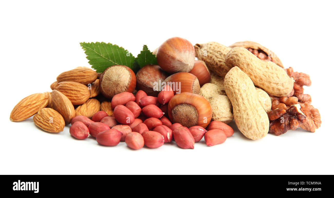 assortment of tasty nuts with leaves, isolated on white Stock Photo - Alamy