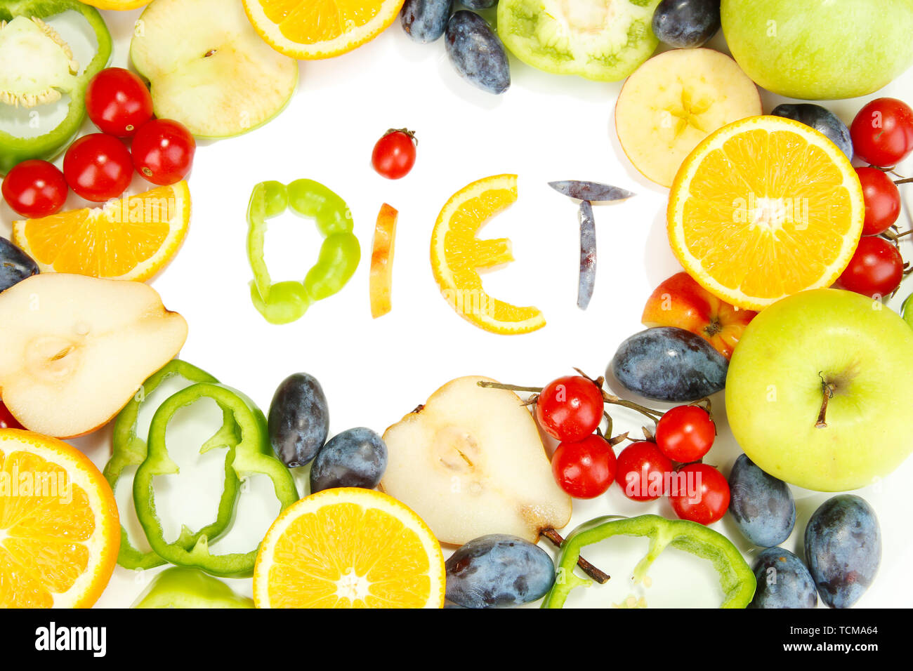 The word Diet lined with pieces of fruits and vegetables isolated on ...