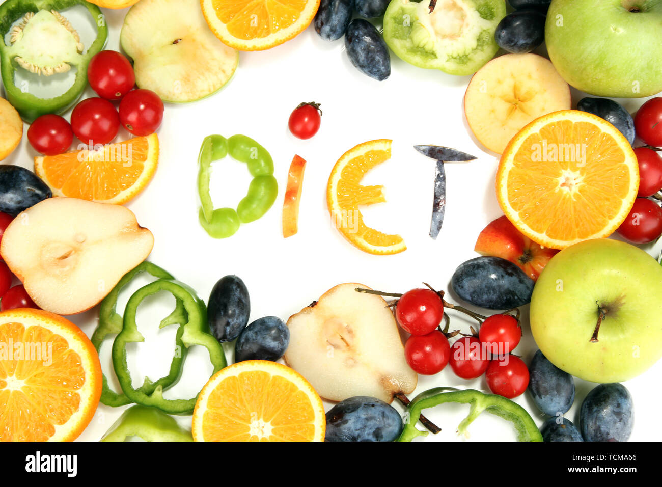 The word Diet lined with pieces of fruits and vegetables isolated on ...