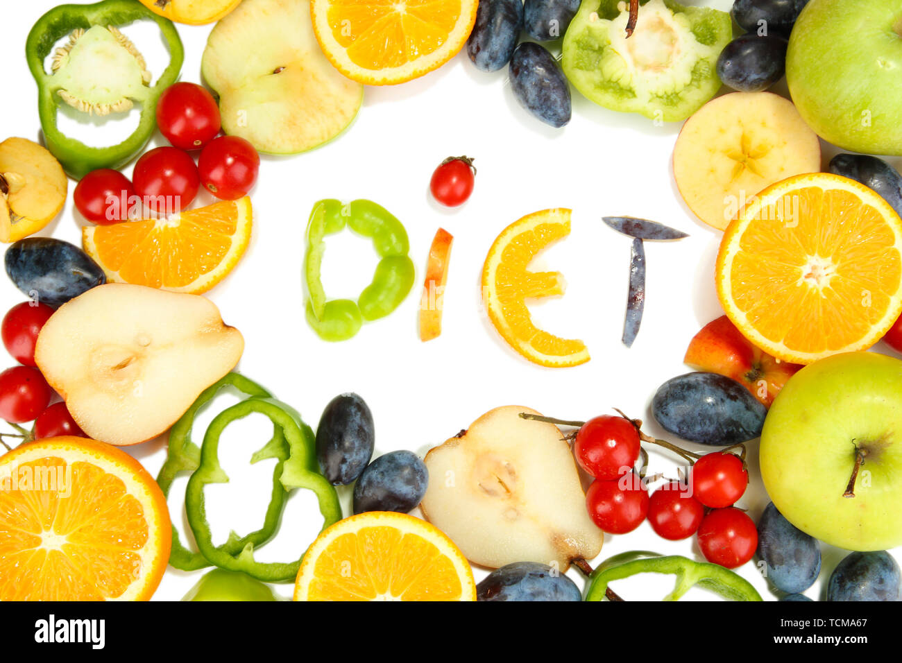 The word Diet lined with pieces of fruits and vegetables isolated on ...