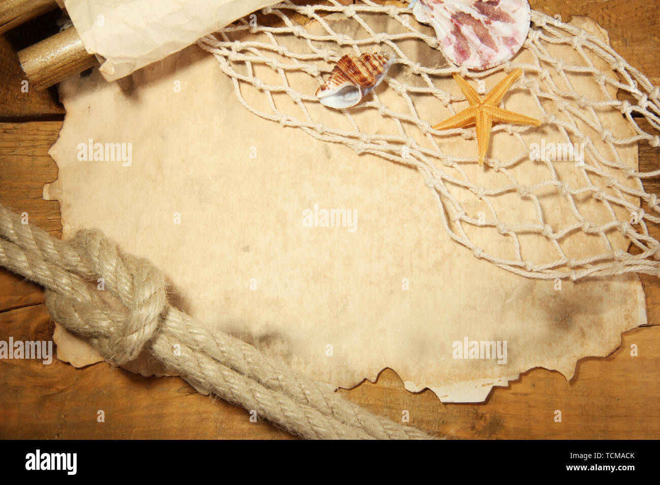 old paper, fishing net and rope on wooden table Stock Photo - Alamy