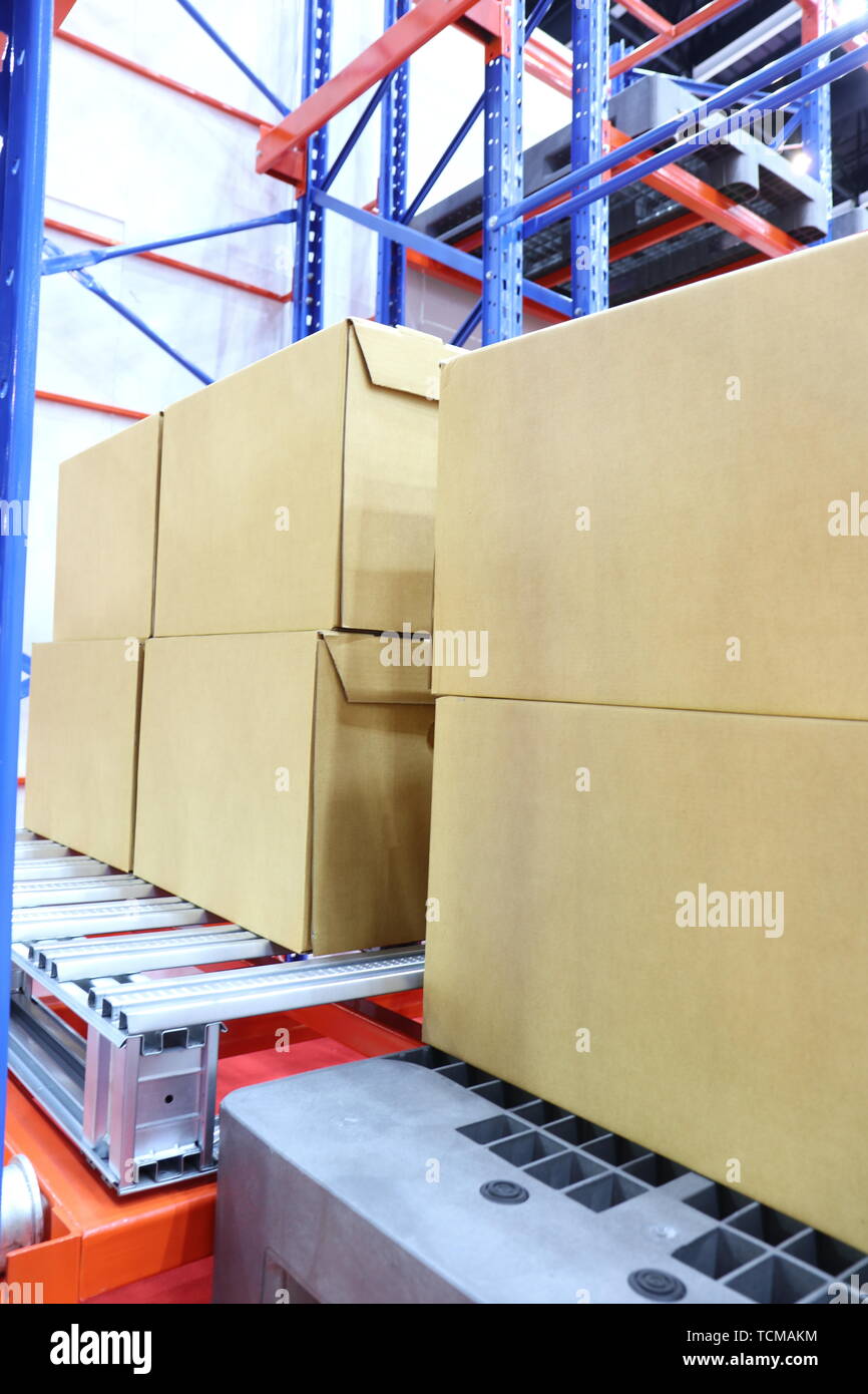 row of cotton boxes kept in warehouse shelves ; logistics Stock Photo ...
