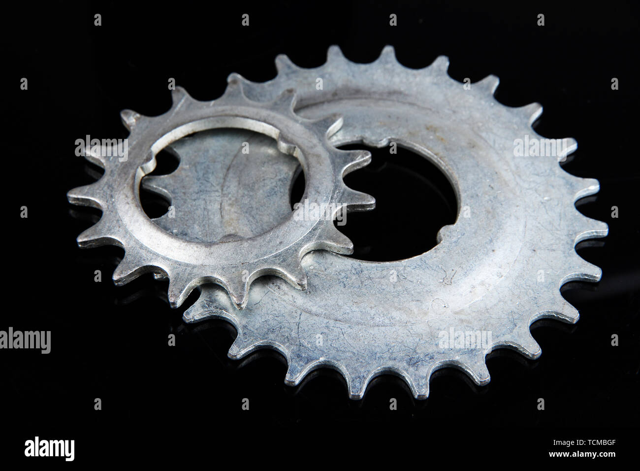 Metal cogwheels on black background Stock Photo - Alamy