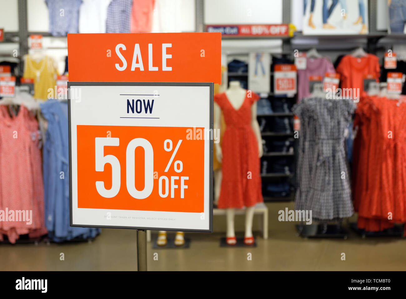 Red sale sign in store Stock Photo - Alamy