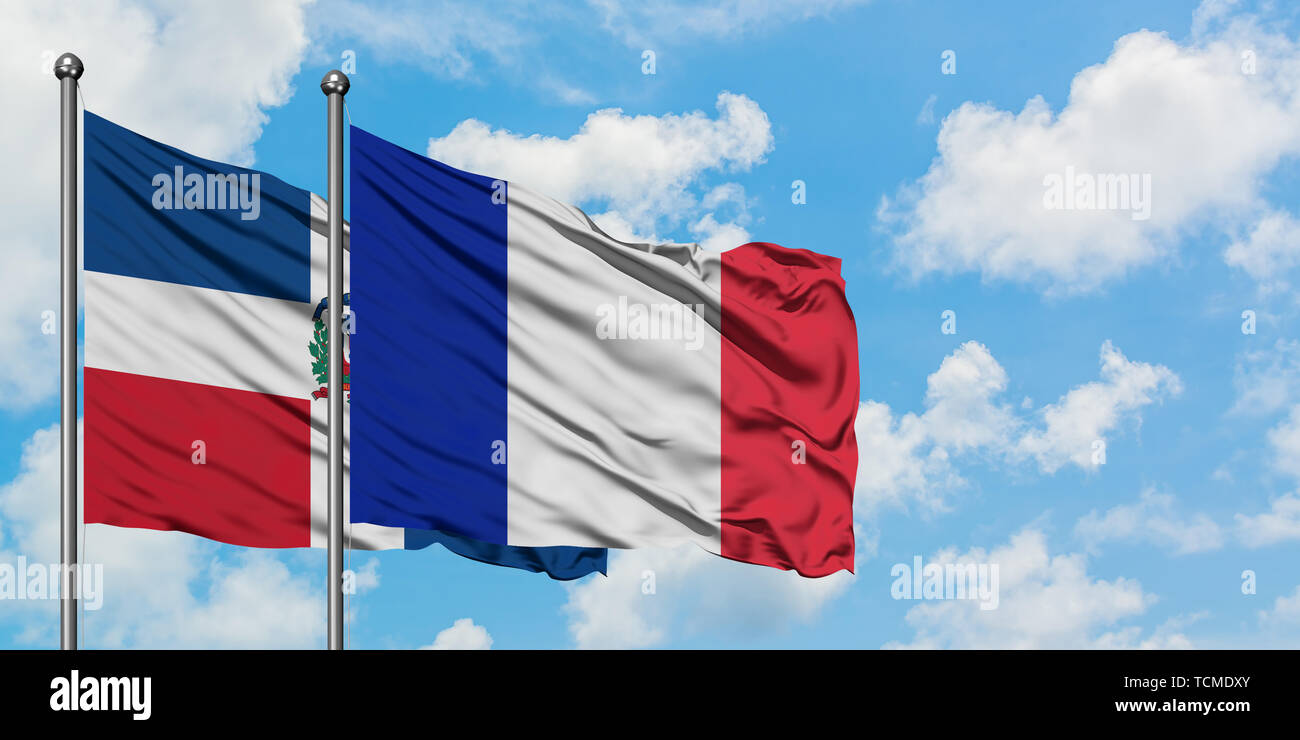 Dominican Republic and France flag waving in the wind against white ...