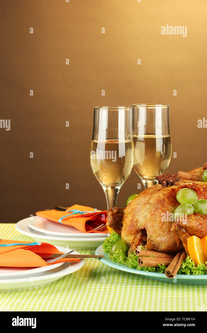 banquet table with roast chicken on brown background close-up ...