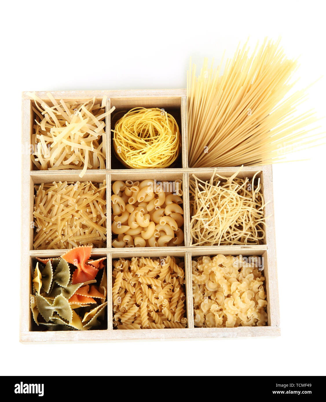 Nine types of pasta in wooden box sections isolated on white Stock ...