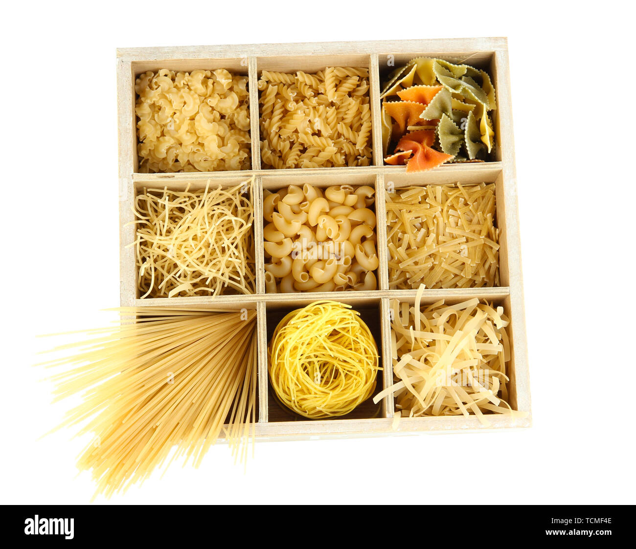 Nine types of pasta in wooden box sections isolated on white Stock ...