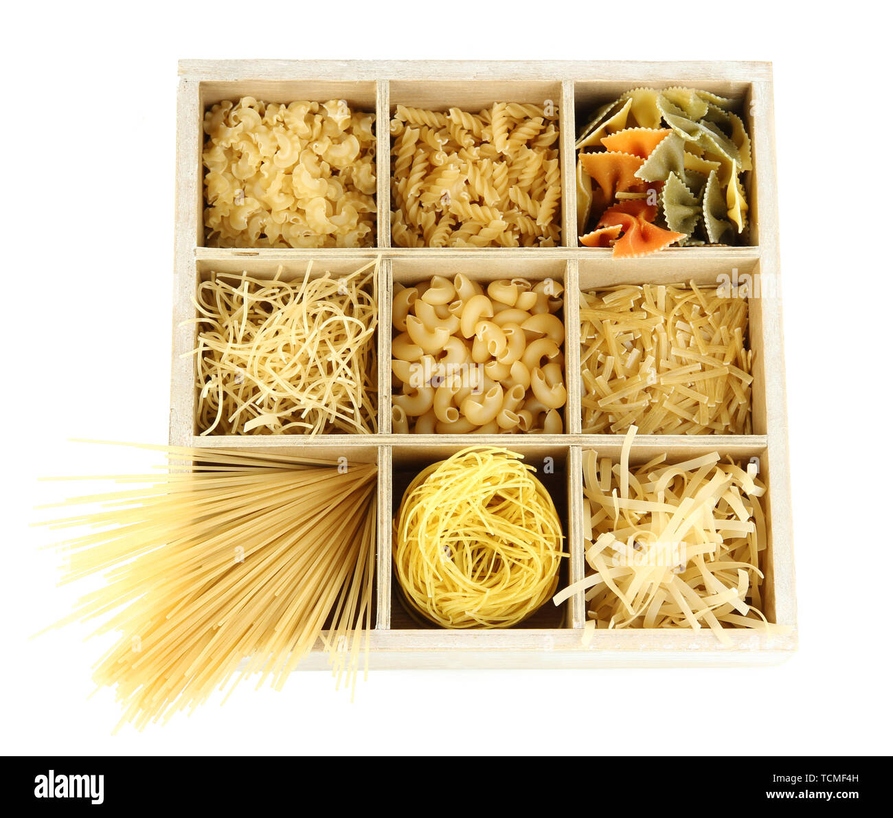Nine types of pasta in wooden box sections isolated on white Stock ...