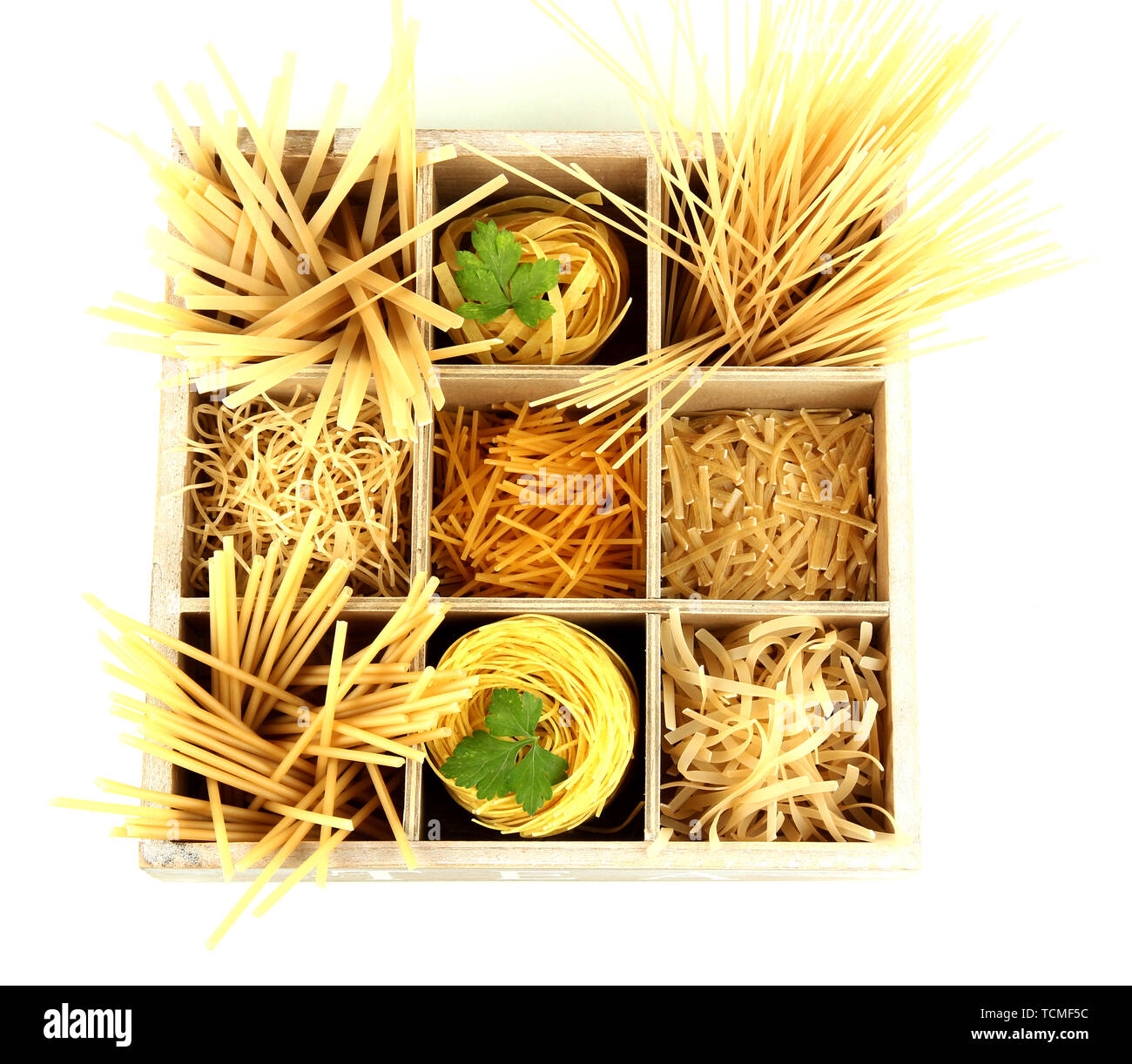 Nine types of pasta in wooden box sections isolated on white Stock ...