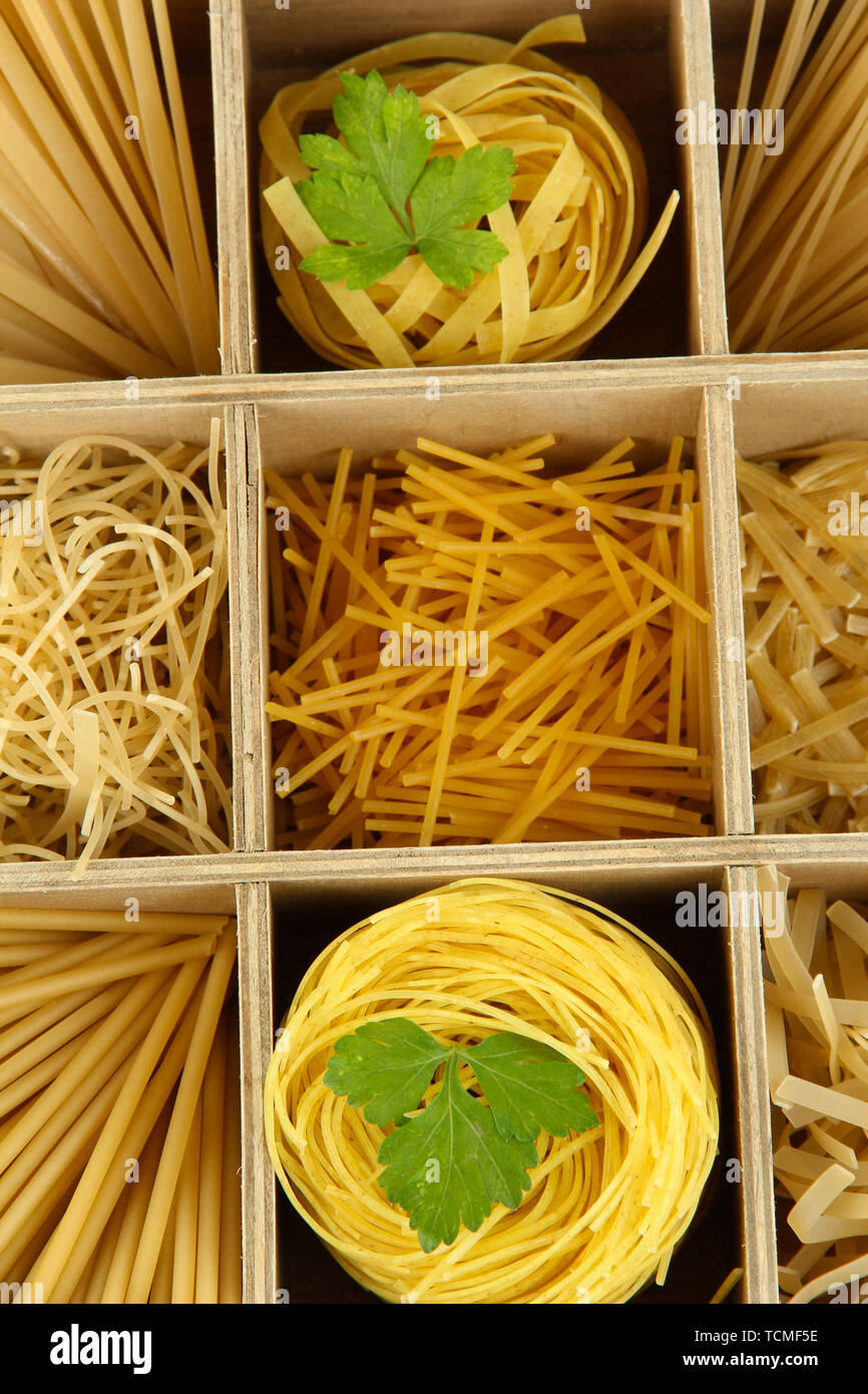 Nine types of pasta in wooden box sections close-up Stock Photo - Alamy