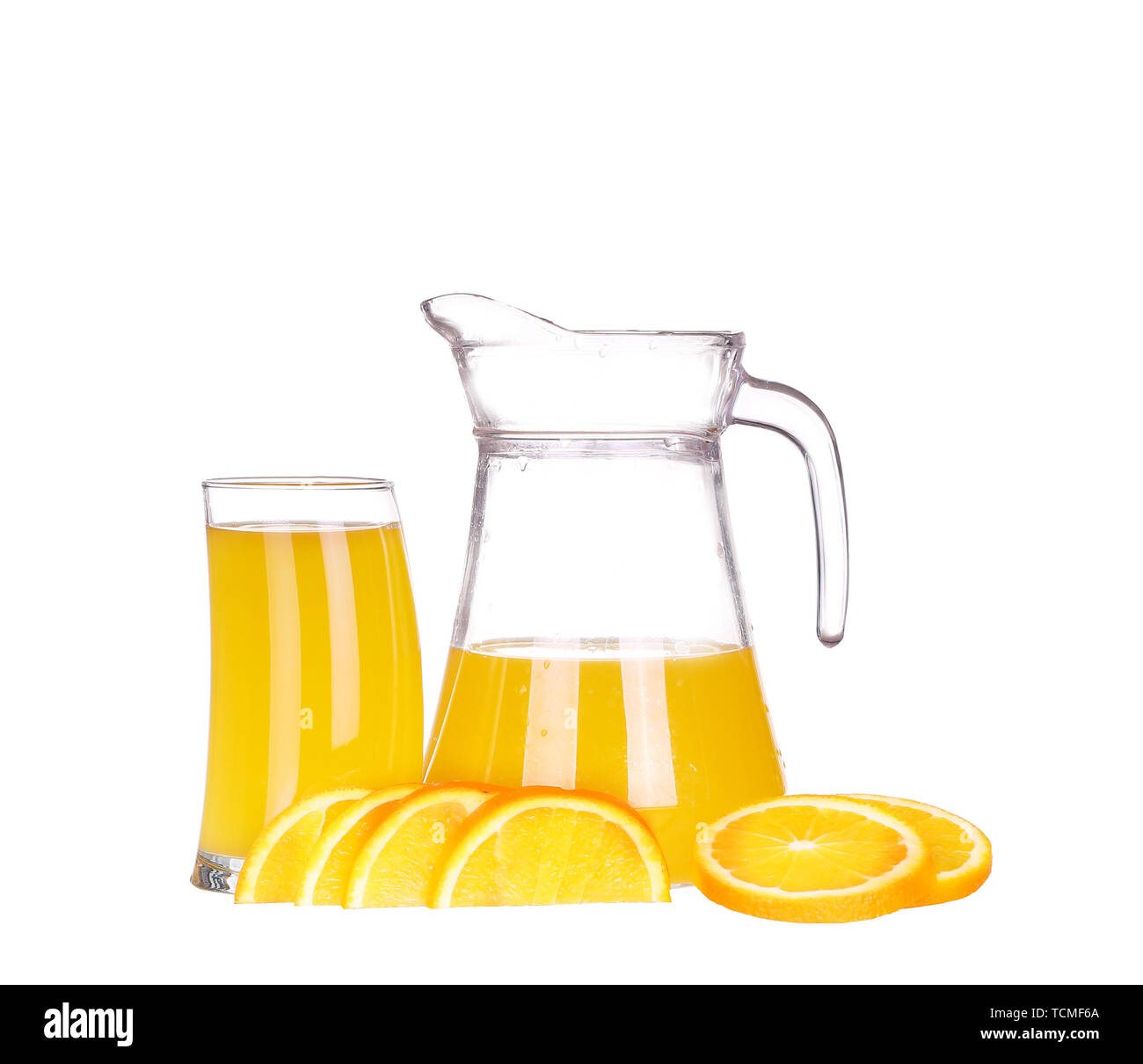 Orange juice in pitcher and oranges. Isolated on white background Stock ...