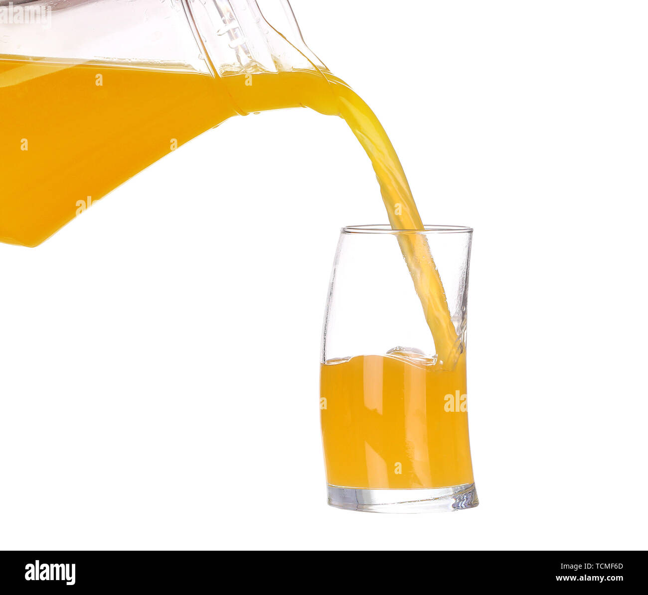 orange juice pouring into glass Stock Photo - Alamy