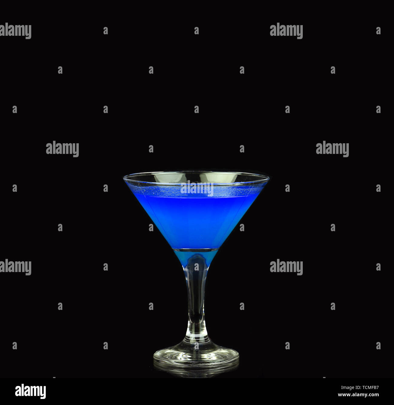 Blue alcoholic cocktail on the black background Stock Photo - Alamy