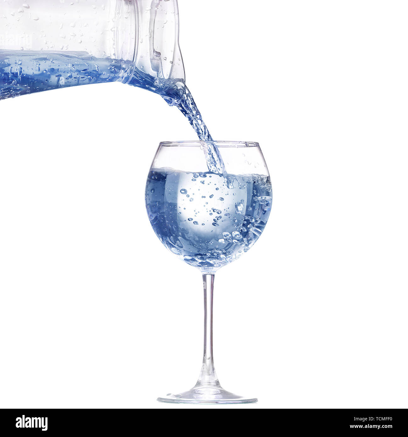 Pouring water from glass pitcher on white background Stock Photo - Alamy