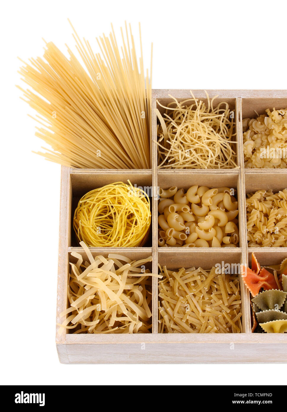 Nine types of pasta in wooden box sections isolated on white Stock ...