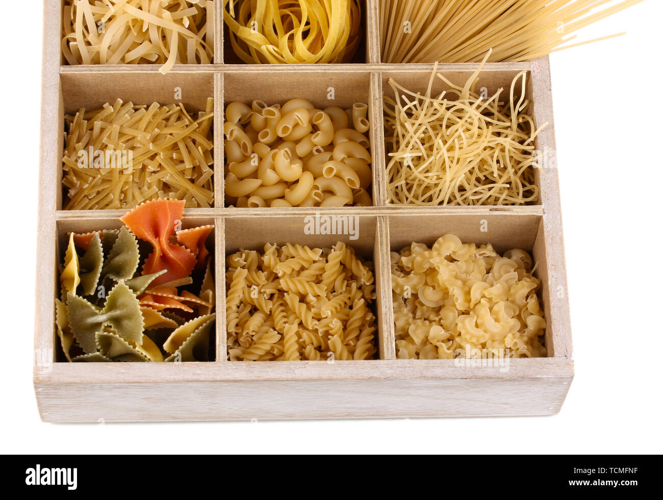 Nine types of pasta in wooden box sections isolated on white Stock ...