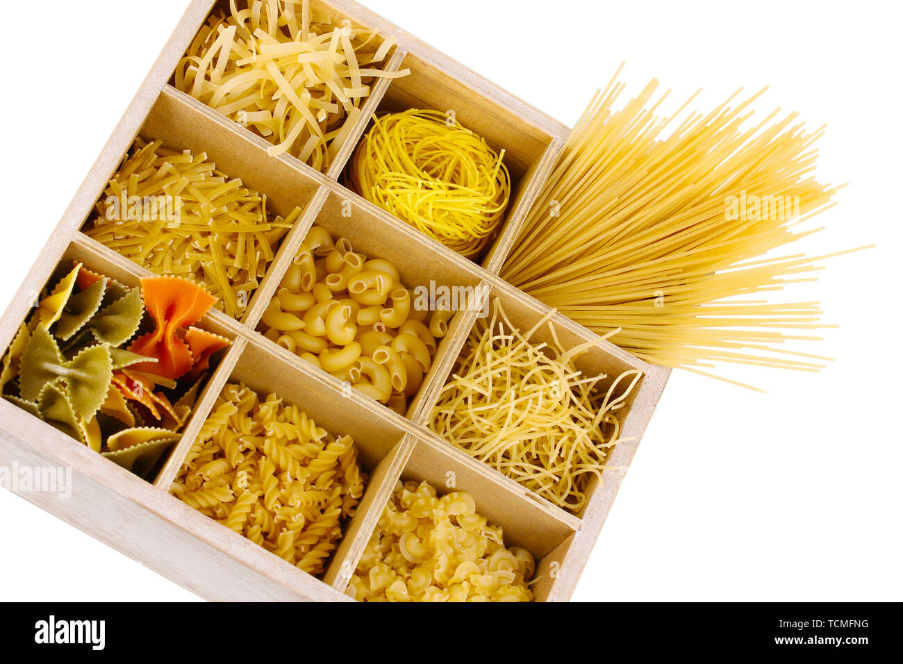 Nine types of pasta in wooden box sections isolated on white Stock ...