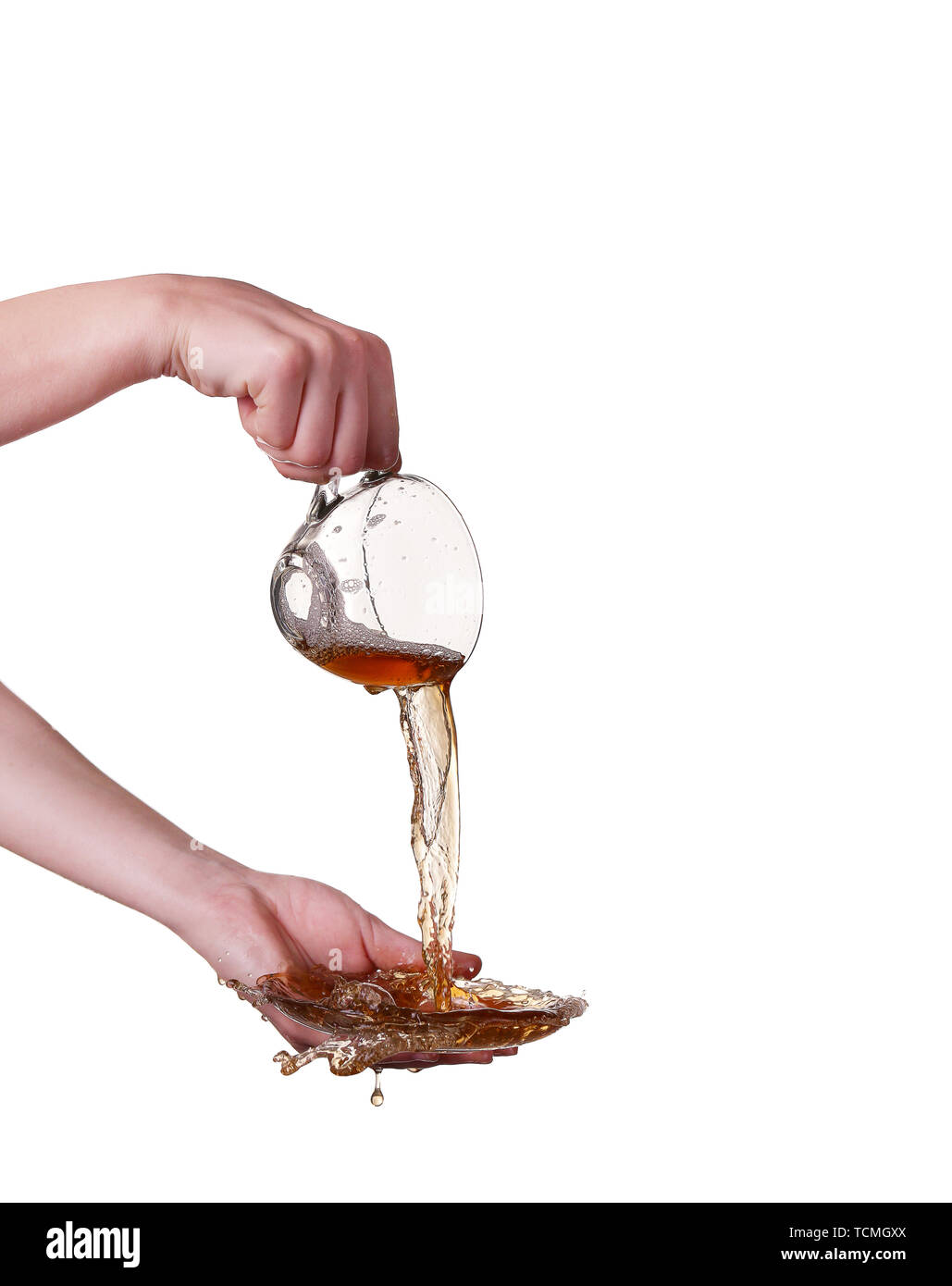 Glass cup of tea with splash Stock Photo - Alamy
