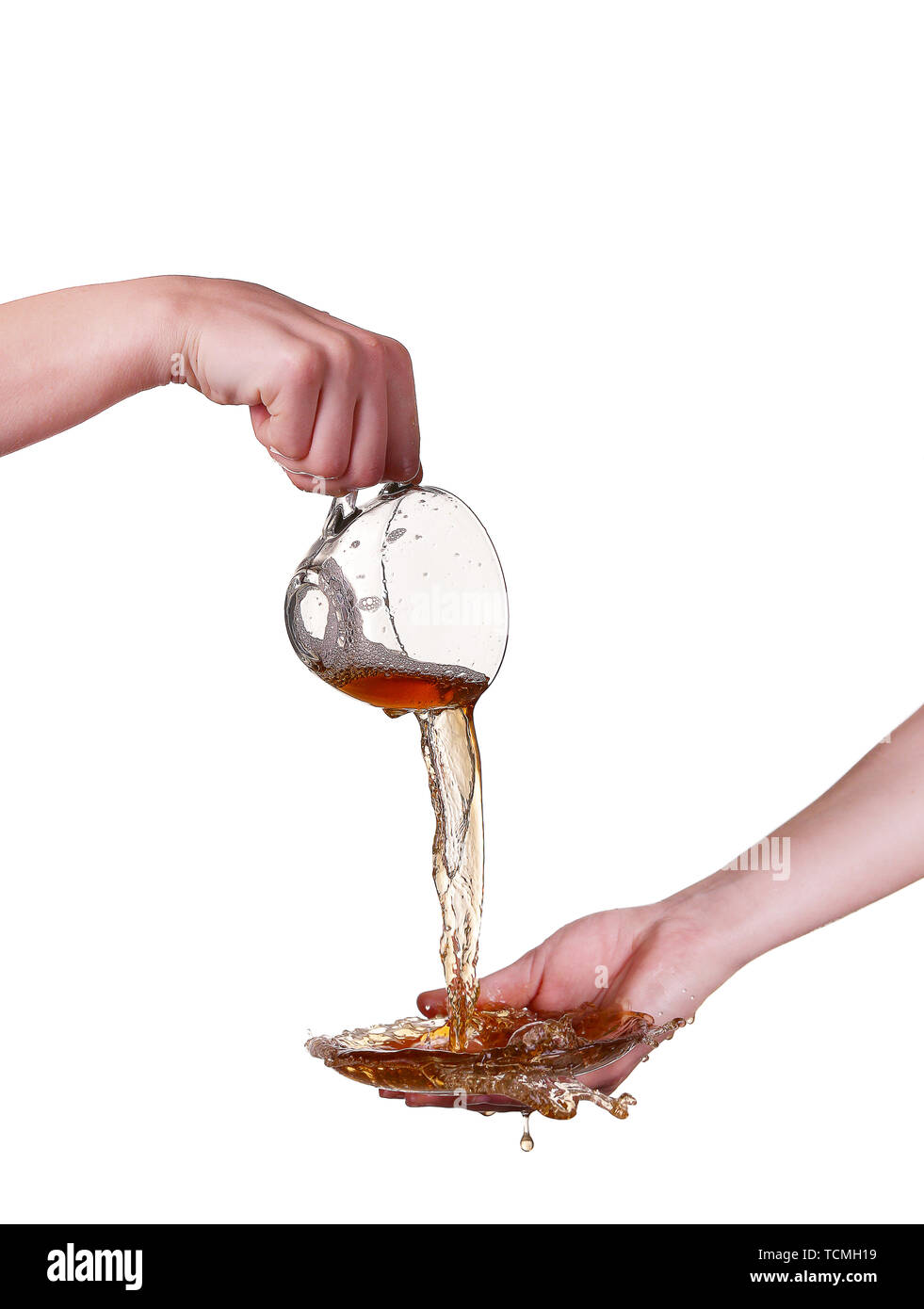 Glass cup of tea with splash Stock Photo - Alamy