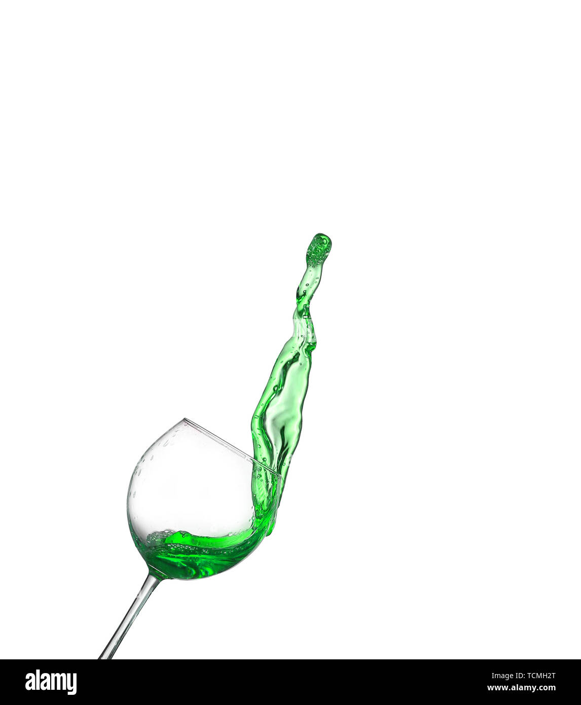 Green alcoholic cocktail on white isolate splash Stock Photo - Alamy