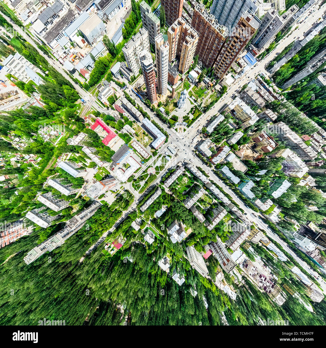 Aerial city view with crossroads and roads, houses, buildings, parks ...