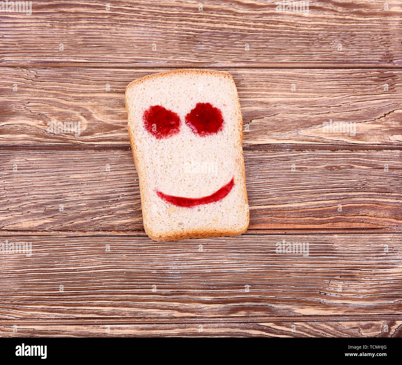Happy smiley face made of ketchup on a slice of bread Stock Photo - Alamy