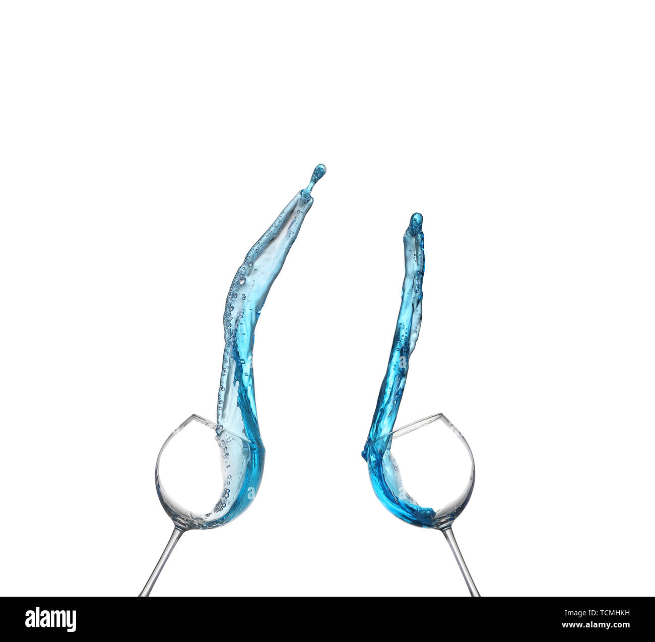 Blue alcoholic cocktail on white isolate splash Stock Photo - Alamy