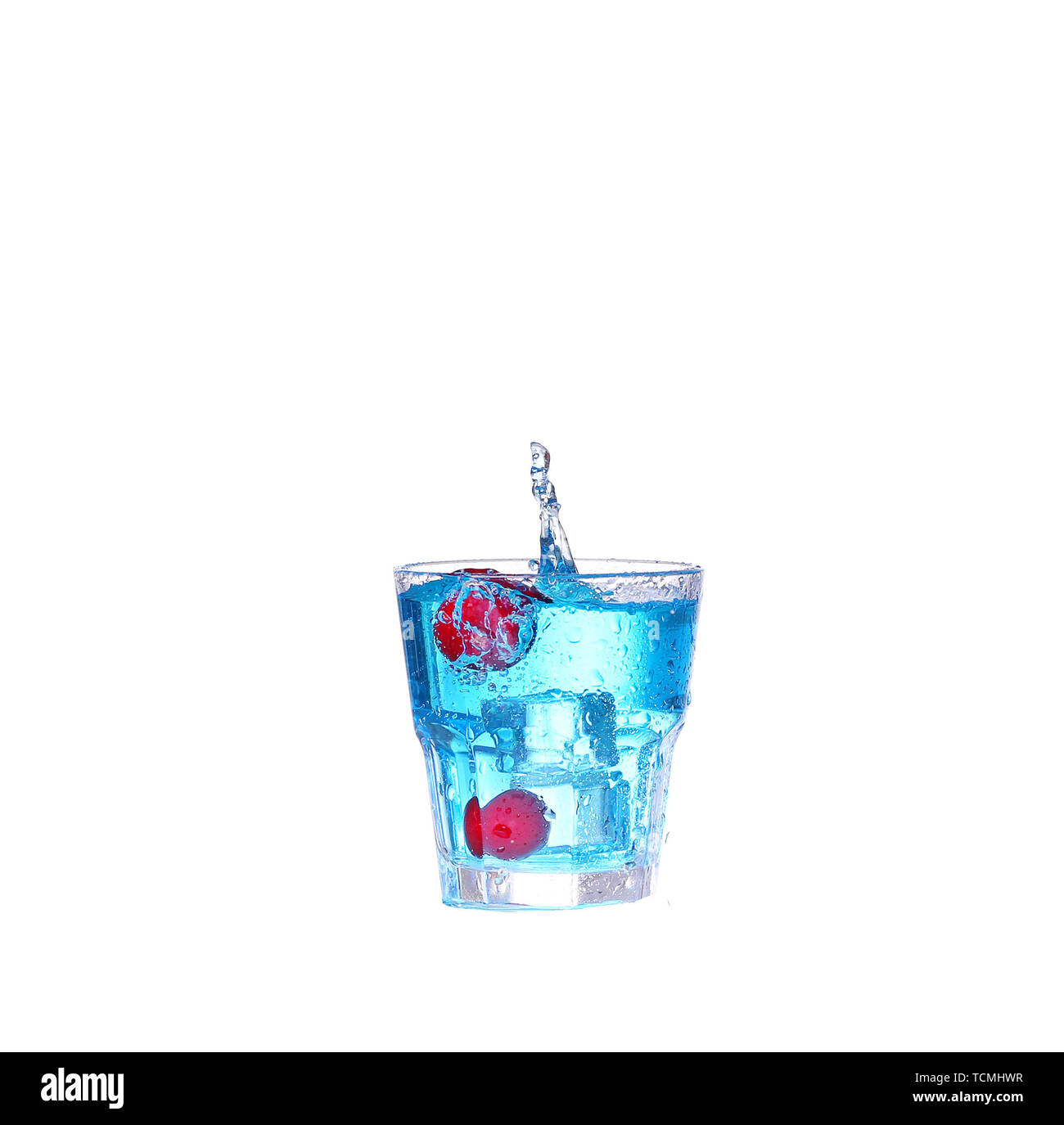 blue cocktail with cherry splash on white Stock Photo - Alamy