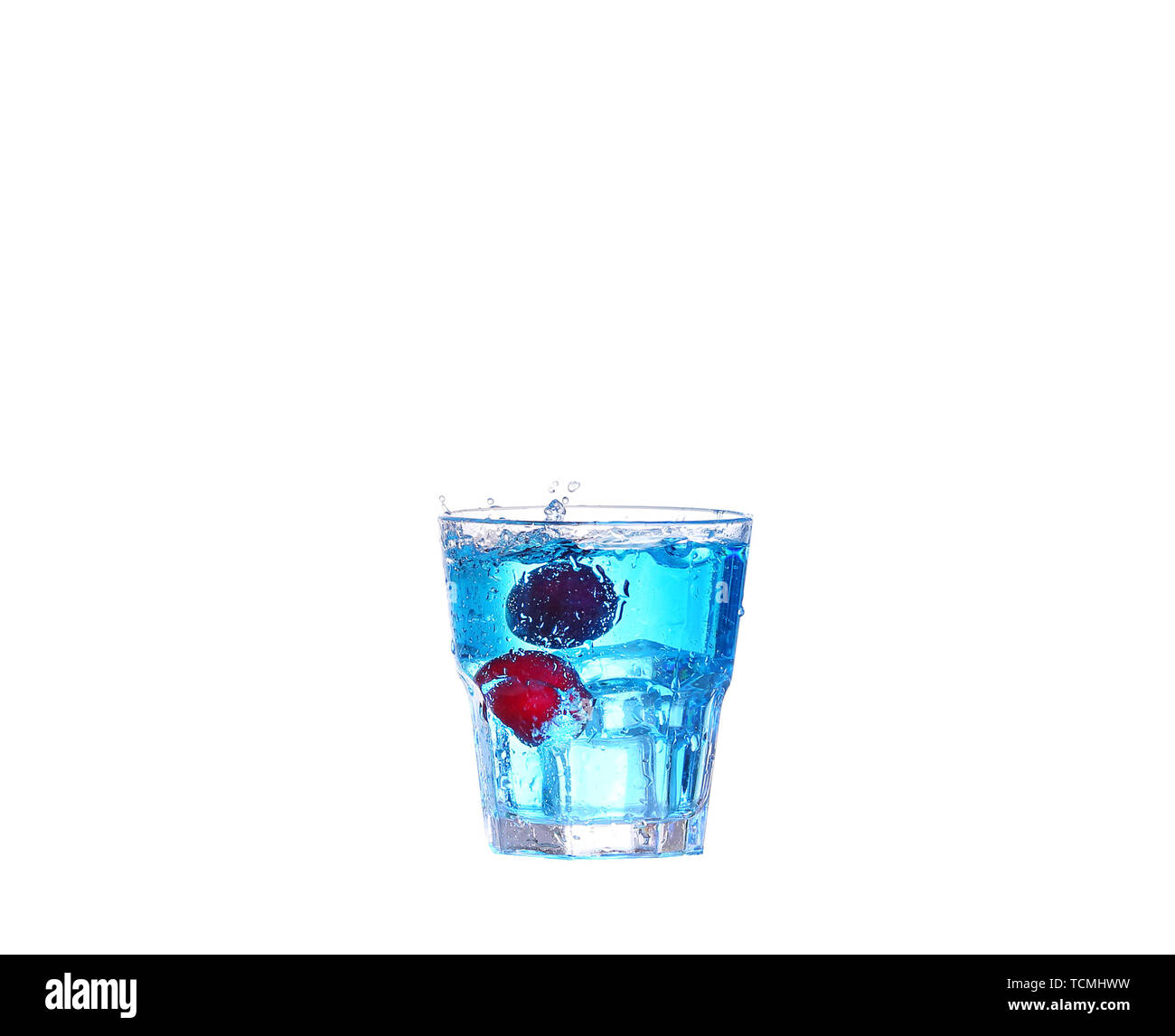 blue cocktail with cherry splash on white Stock Photo - Alamy