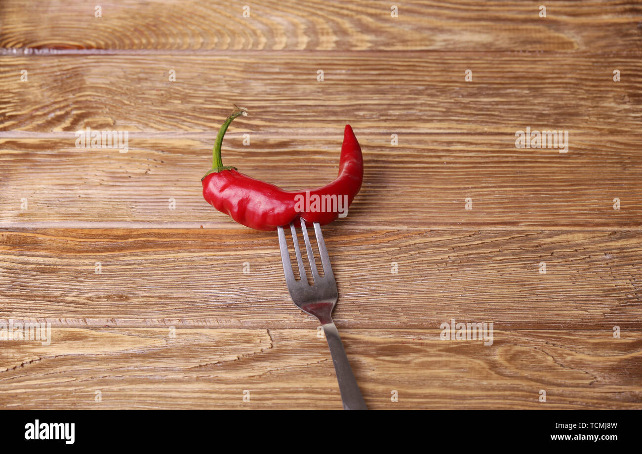 Chilli peppers and wood texture , background Stock Photo - Alamy