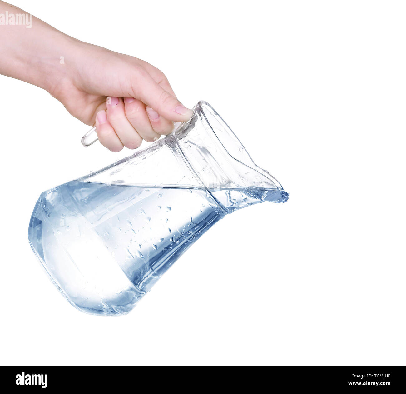 Pouring water from glass pitcher on white background Stock Photo - Alamy
