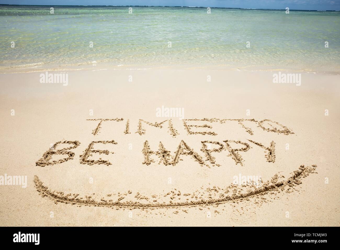 Close-up Of Time To Be Happy Text And Smile Written On Sand At Beach ...