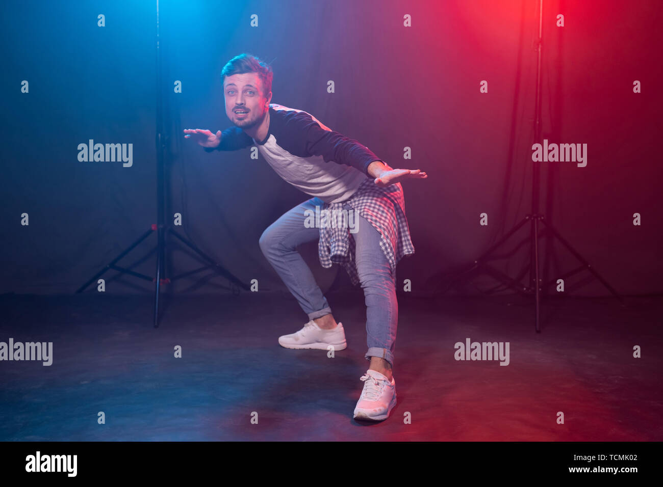 Dance, hip-hop and reggaeton concept - young man dancing over the ...