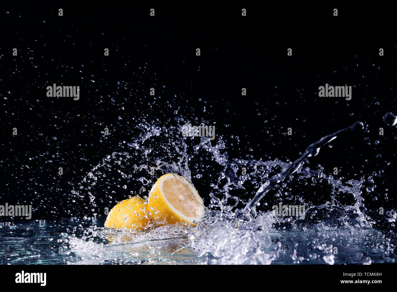 Sliced lime lemon falling water hi-res stock photography and images - Alamy