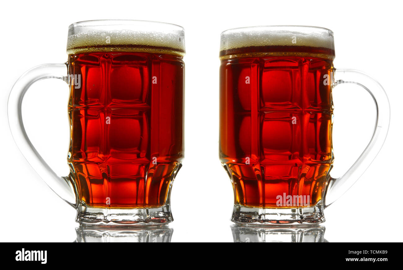 two tankards of kvass, isolated on white Stock Photo - Alamy